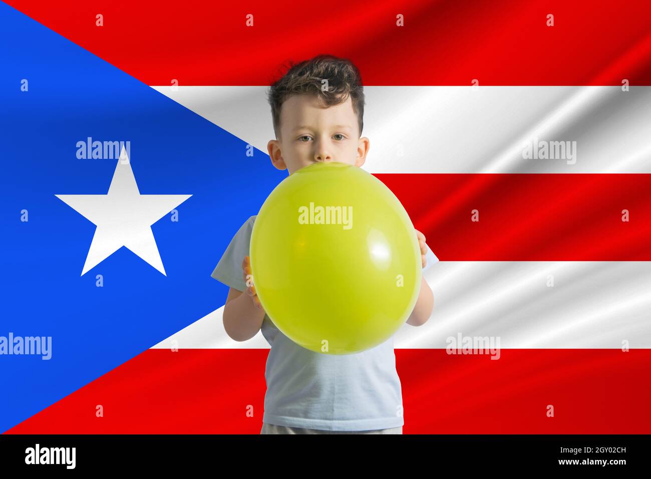 Children's day in Puerto Rico. White boy with a balloon on the ...