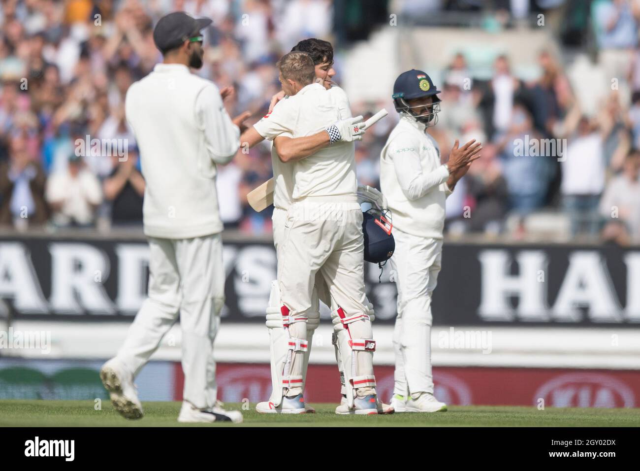 England’s Alastair Cook celebrates scoring 100 during his final test ...