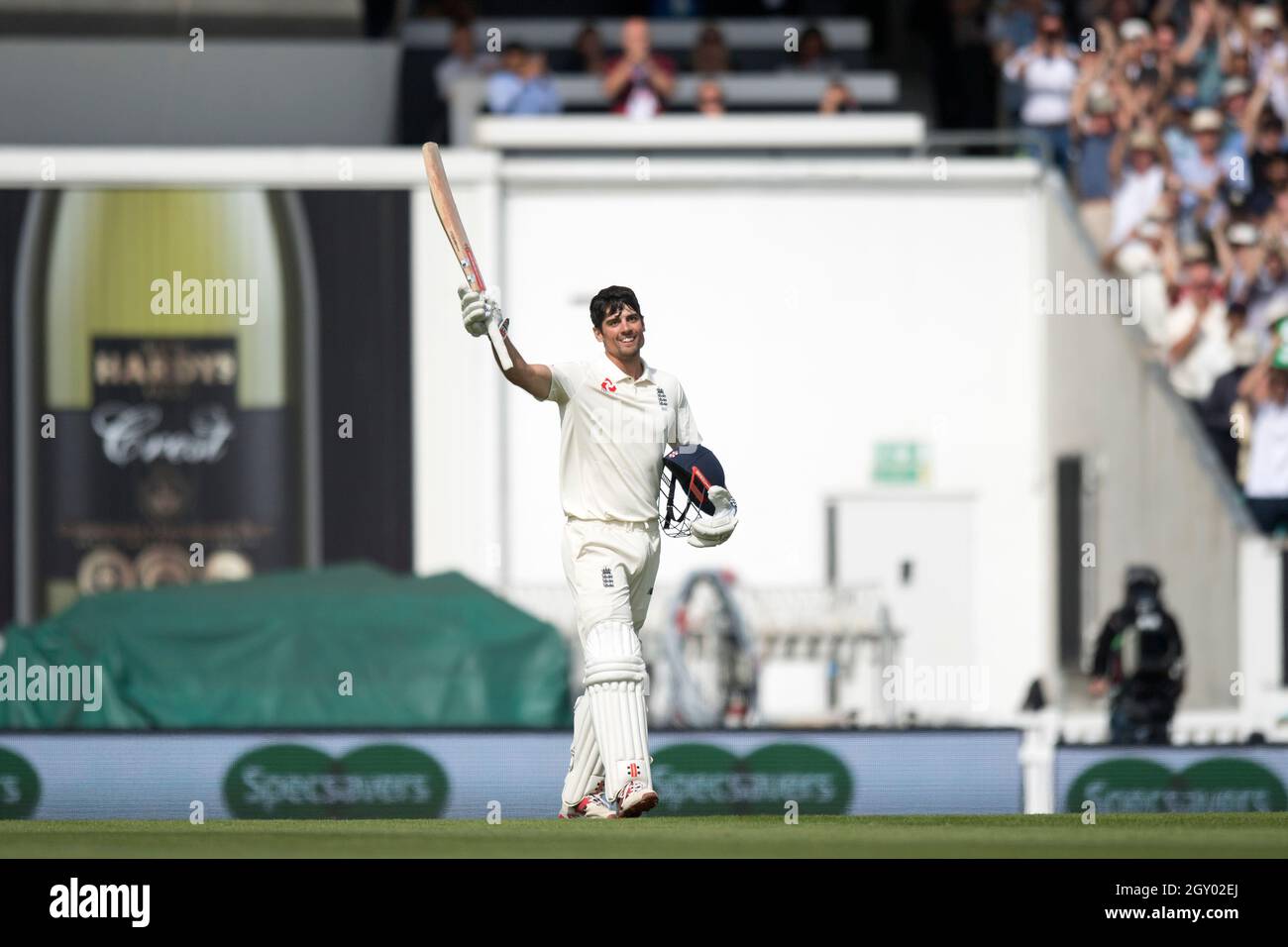England’s Alastair Cook celebrates scoring 100 during his final test ...