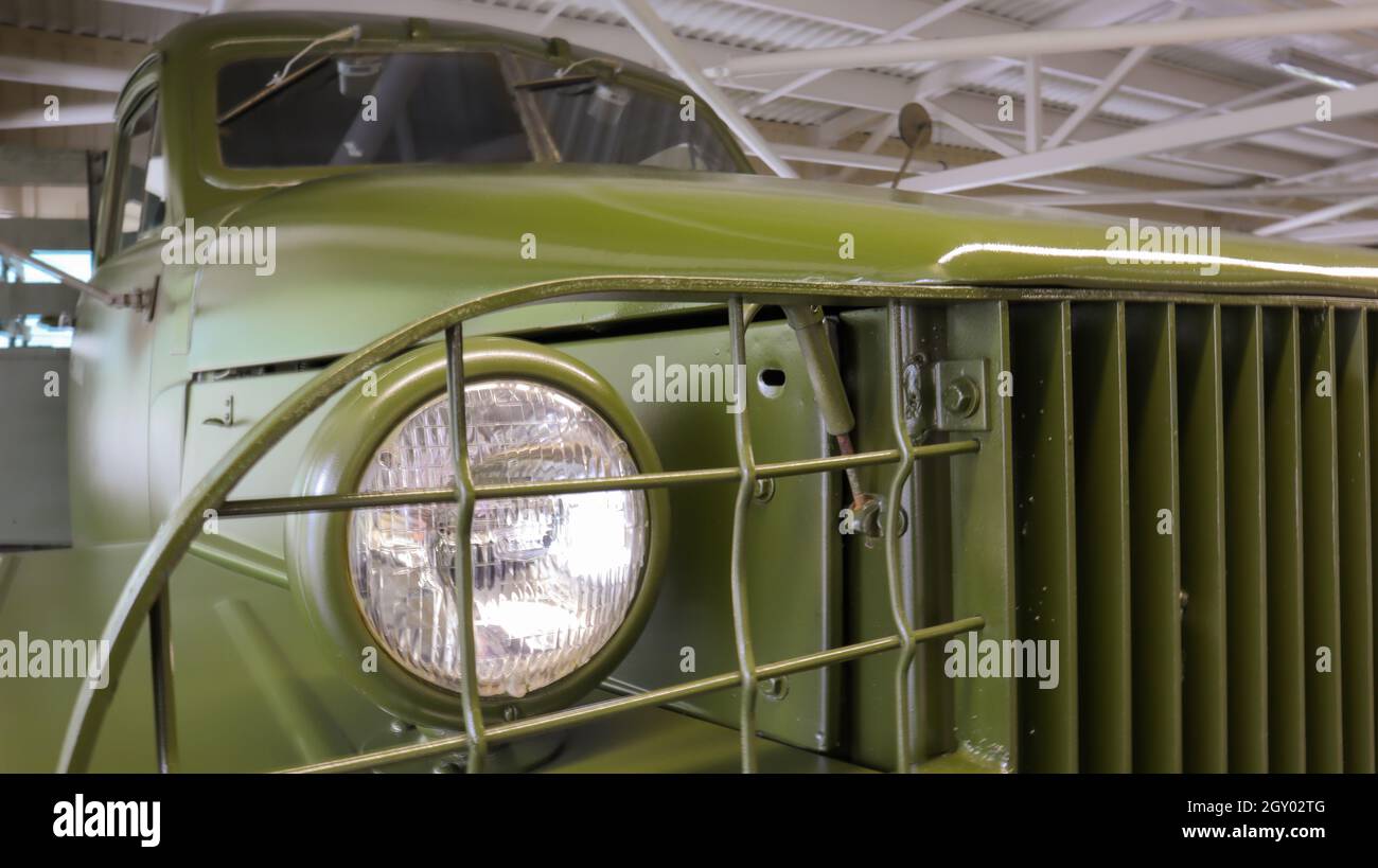A close-up of the Studebaker US6 round headlight. Three-axle truck produced from 1941 to 1945 ...
