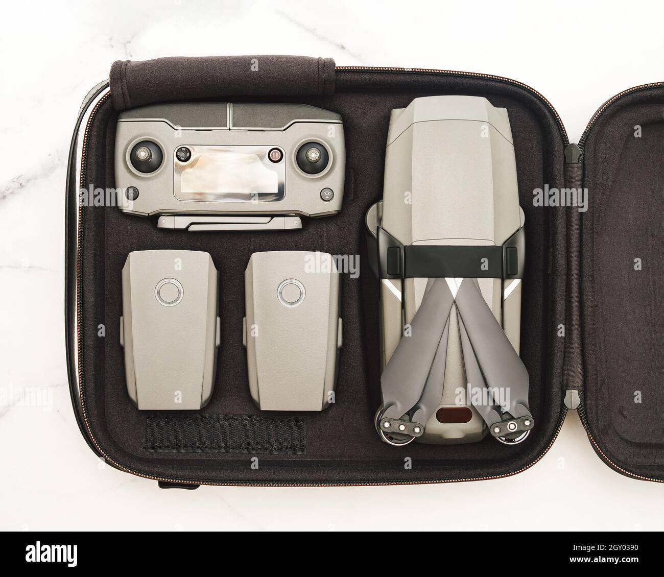 Folding drone quadcopter with full set in case. Top view or flat lay ...