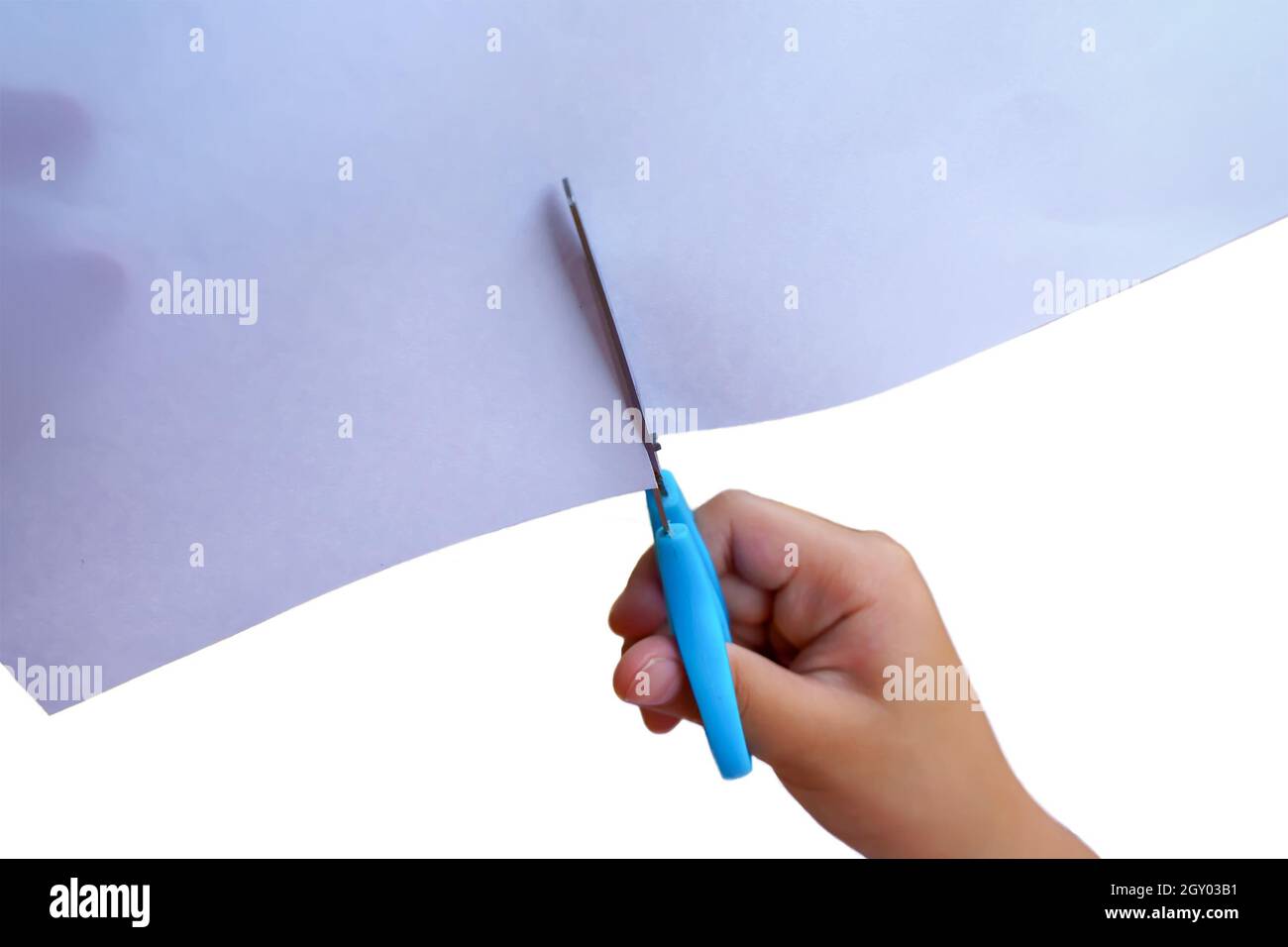 A girl is using scissors of paper cutting on a white backgrounds Stock ...
