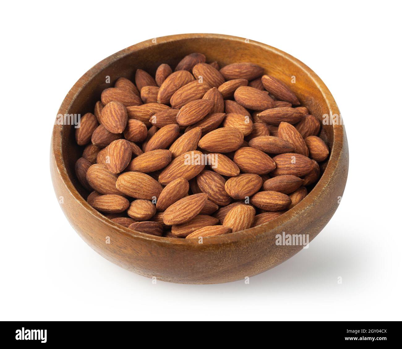 Almonds in wooden bowl isolated on white background with clipping path ...