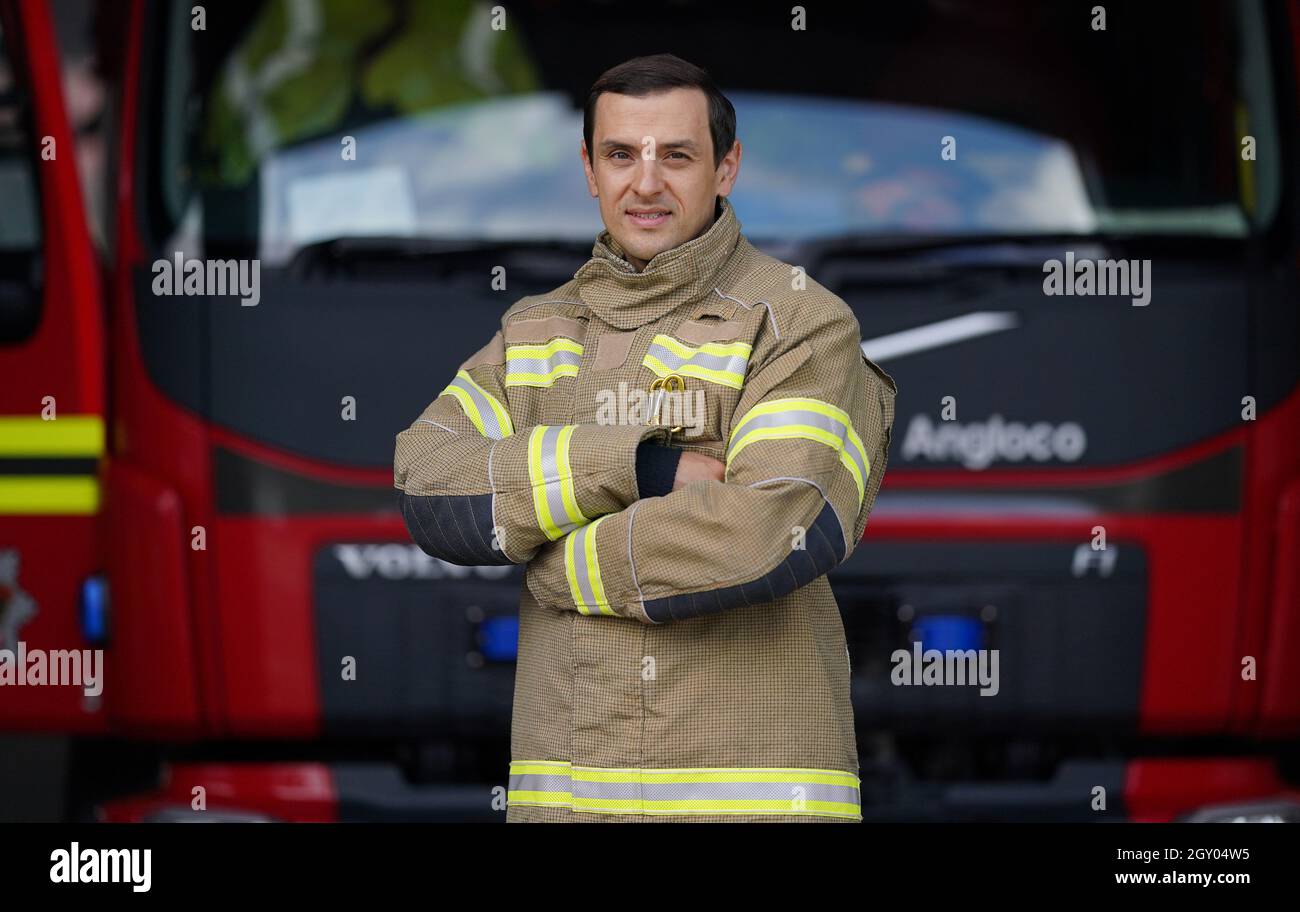 Former football player now fire fighter, Alex Nicholls poses for a ...