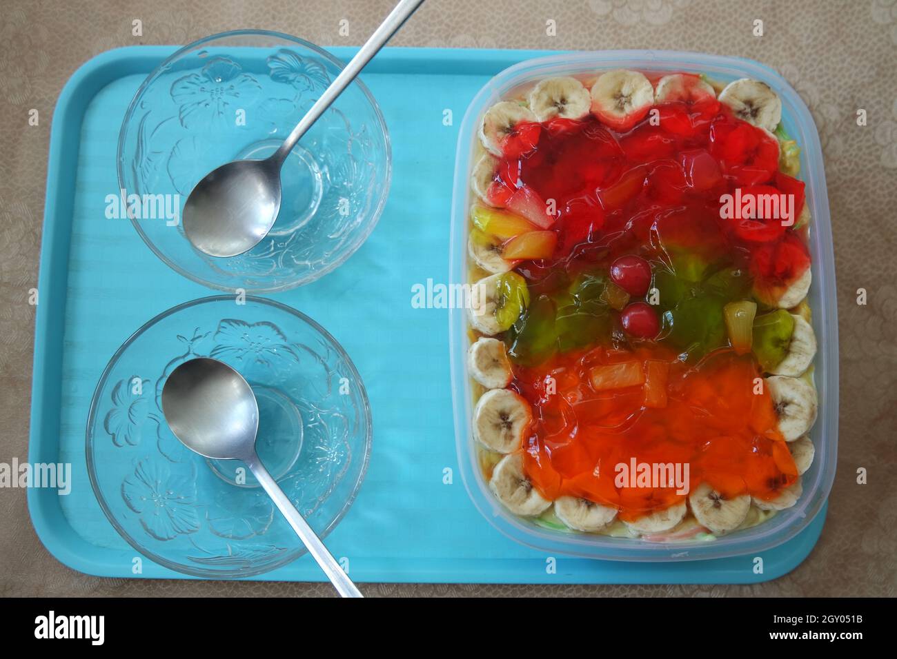 Creamy custard sweet dish with with different slices layered on surface ...