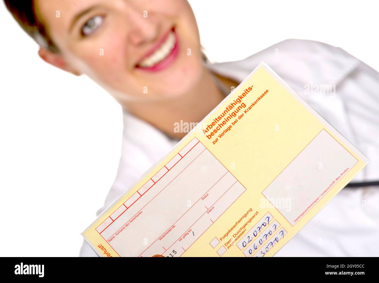 female doctor holding a certificate of incapacity for work in hand ...