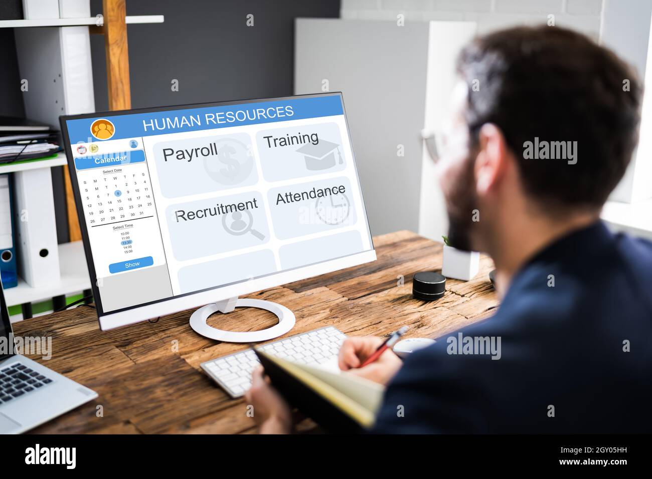 Hr manager using software hi-res stock photography and images - Alamy