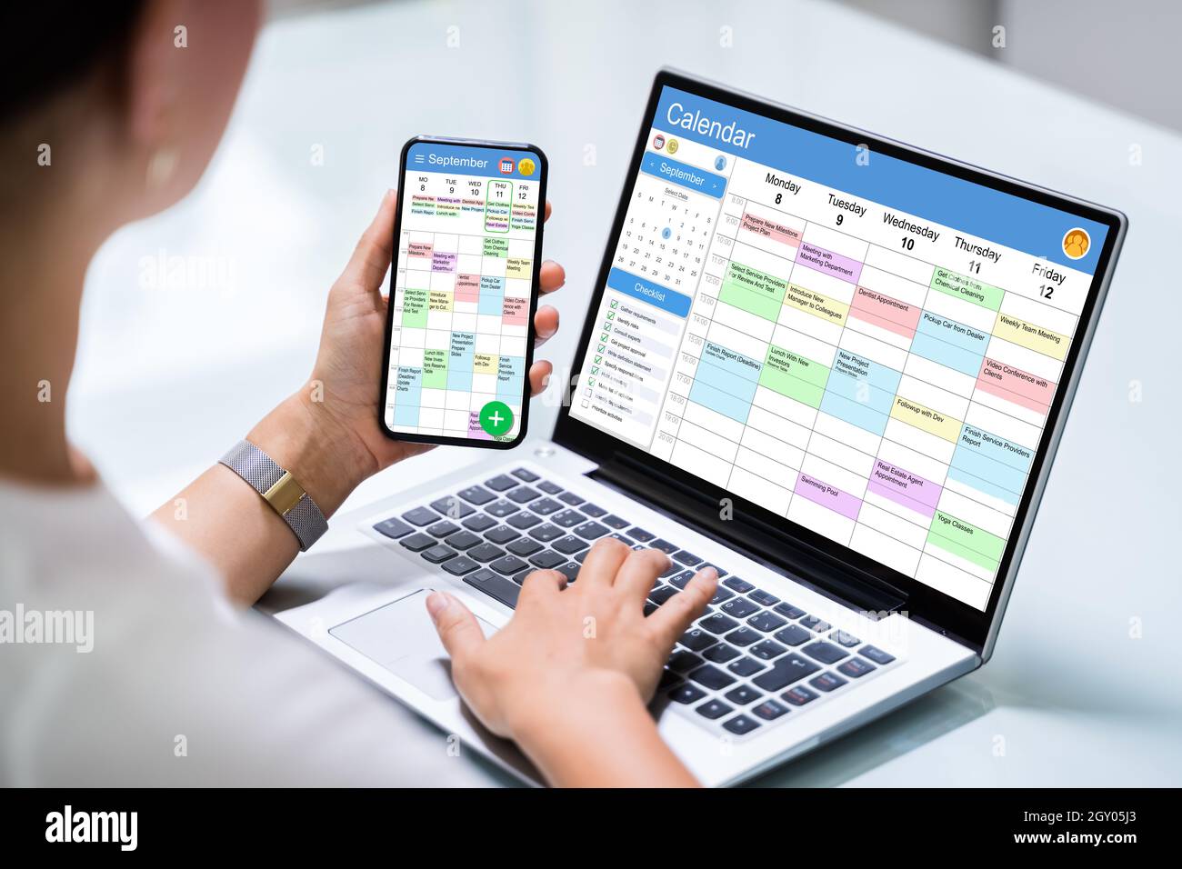 Executive Looking At Calendar On Computer. Arranging Weekly Schedule ...