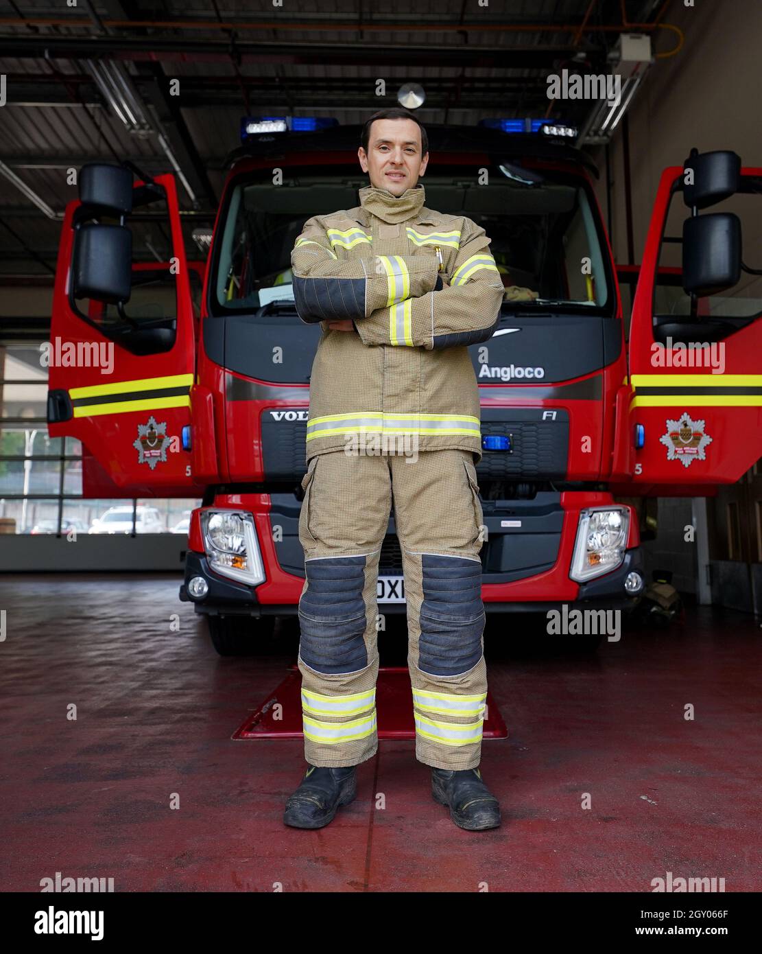 Former football player now fire fighter, Alex Nicholls poses for a ...