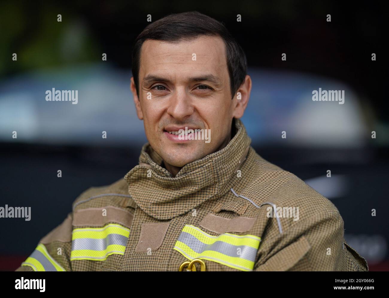Former football player now fire fighter, Alex Nicholls poses for a ...