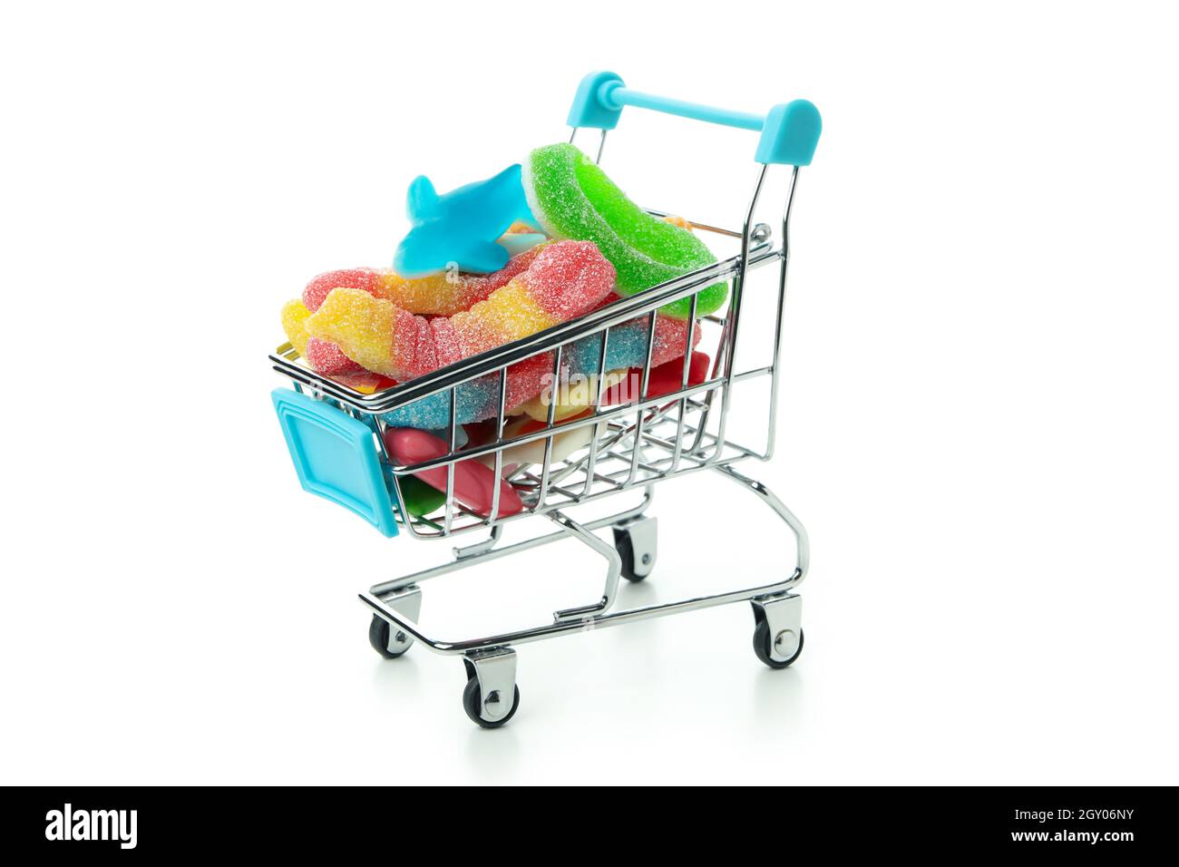 Shop trolley with gummy candies on white background Stock Photo - Alamy
