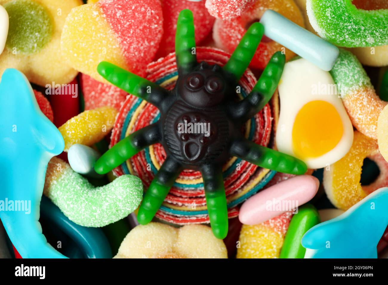 Gummy candies all over background, close up Stock Photo - Alamy