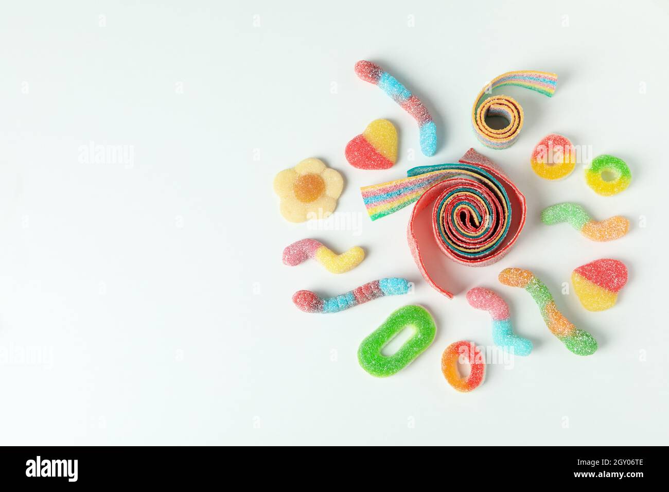Gummy candies on white background, space for text Stock Photo - Alamy
