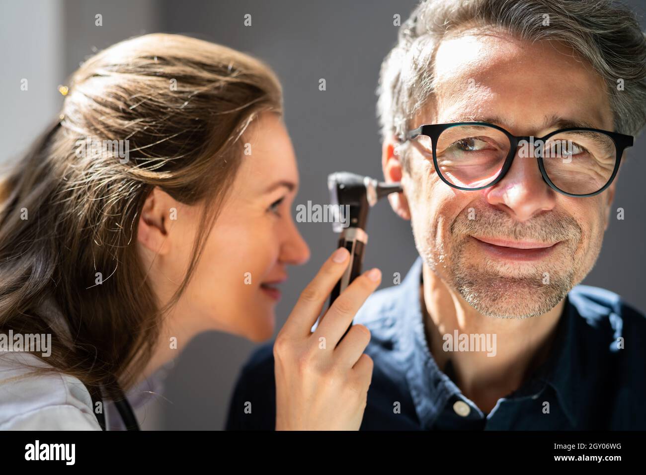 Otolaryngology Ear Check Using Otoscope. Doctor Examining Patient Stock ...