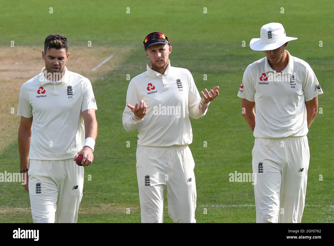 England’s captain Joe Root speaks with James Anderson and Stuart Broad ...