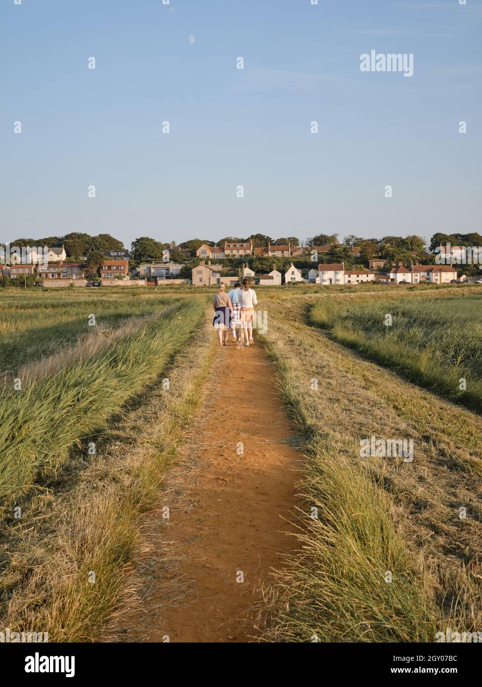 Walking back from the beach to Cley Next The Sea village along the ...