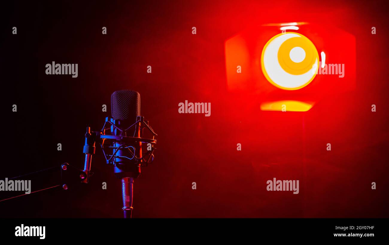 Professional microphone in red smoke on a black background Stock Photo ...