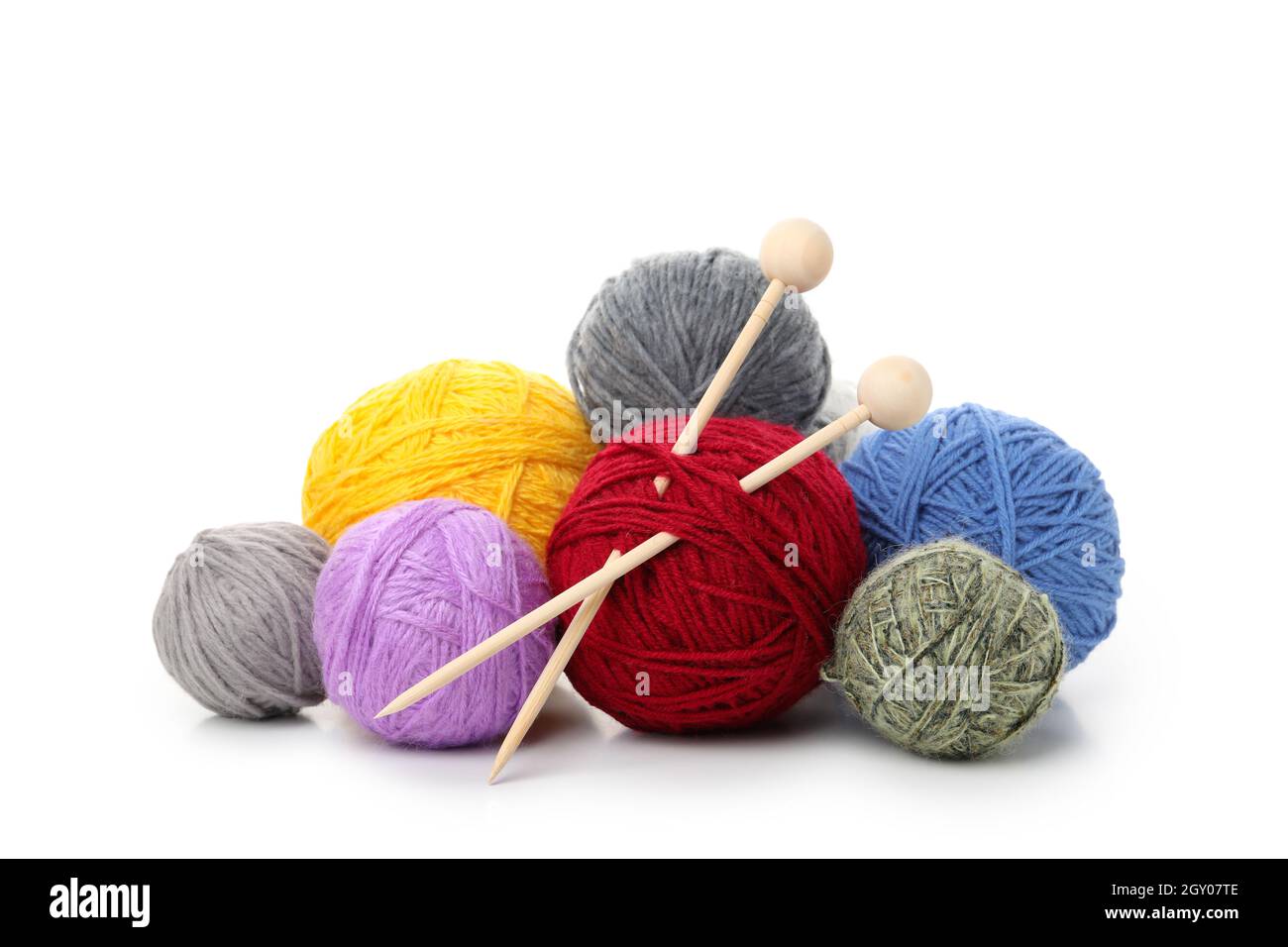 Multi colored balls of yarn with knitting needles, isolated on white ...
