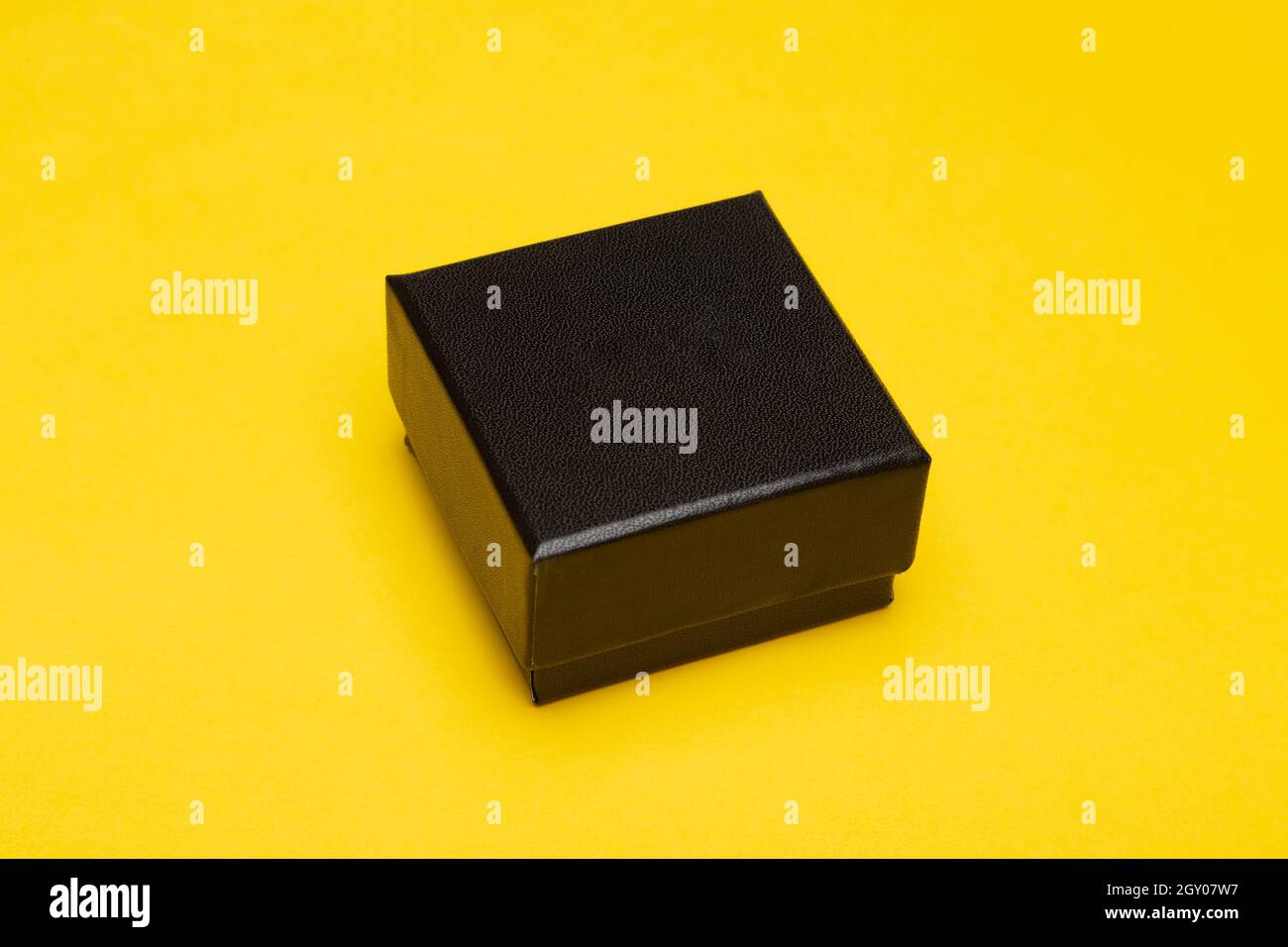 Mini black box product packaging isolated on yellow background Stock ...