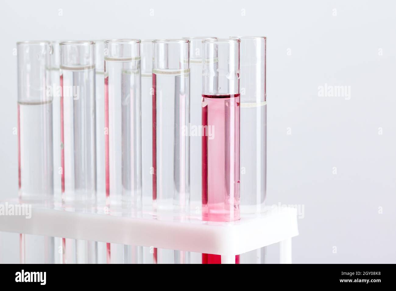 Test flasks with color samples on light grey background Stock Photo - Alamy