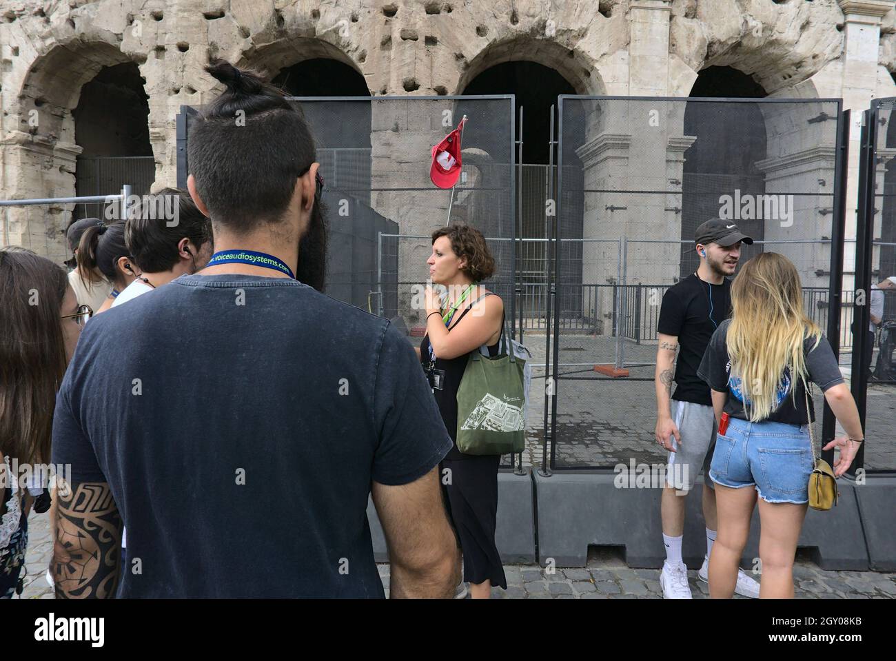 ROME, ITALY - Sep 01, 2019: A tour guide explaining the history of the ...