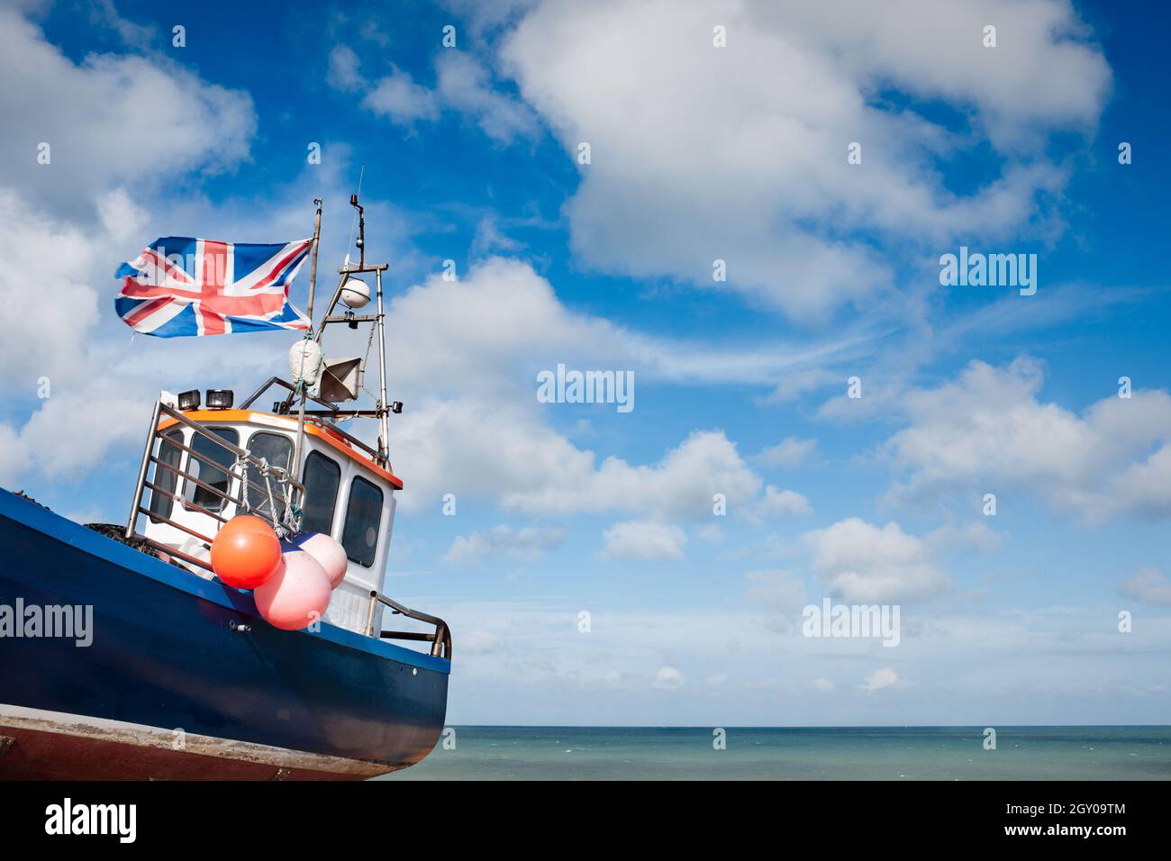 British fishing boat flying the Union Jack flag on the beach at Deal ...