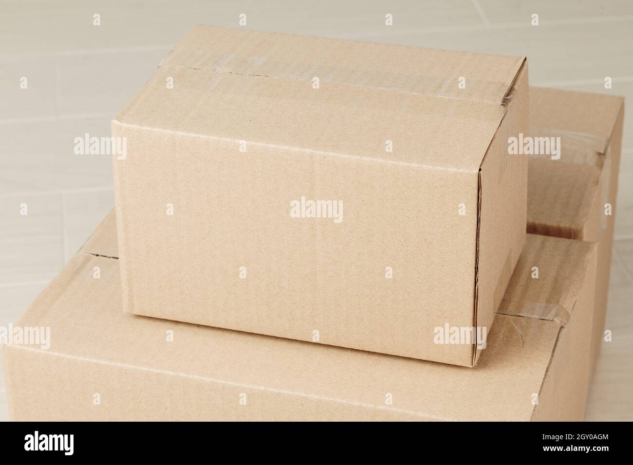 Stack of blank paper cardboard box mockup on the floor, Packaging ...