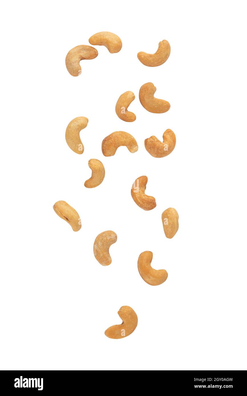 Cashew nuts falling isolated on white background with clipping path ...