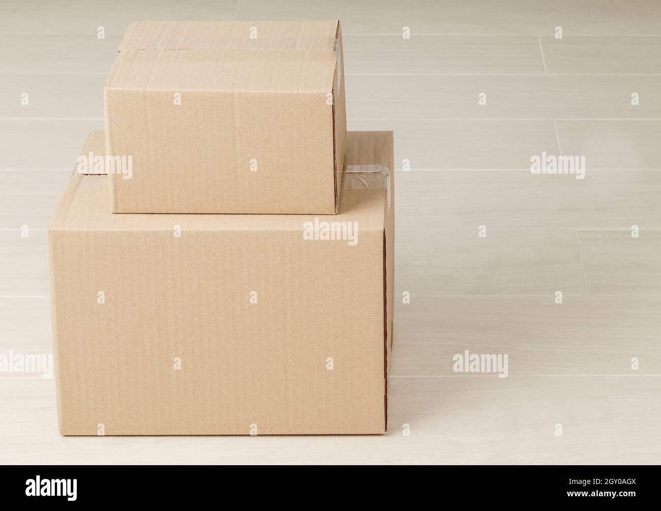 Stack of blank paper cardboard box mockup on the floor, Packaging ...