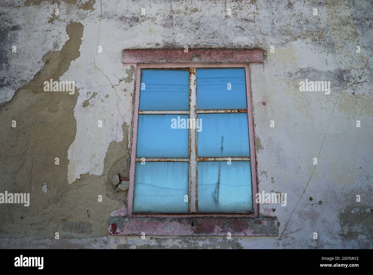 Metal window of an old house exterior view Stock Photo - Alamy