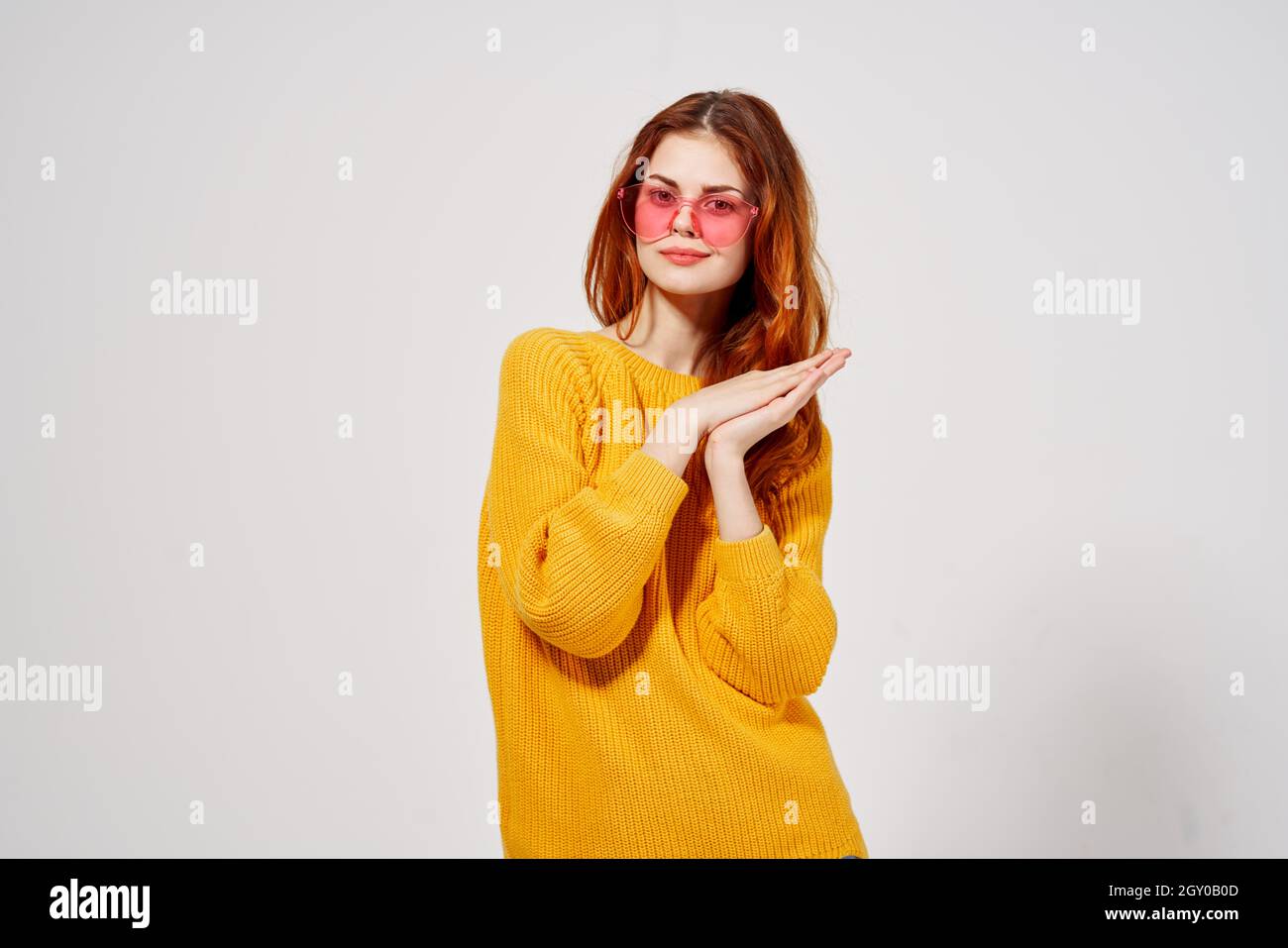 pretty woman in a yellow sweater hairstyle posing Studio fun model ...