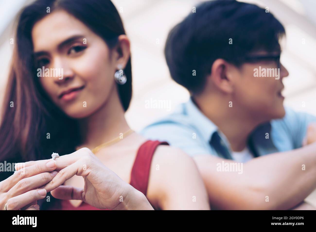 Young woman pulling ring from her finger hi-res stock photography and ...