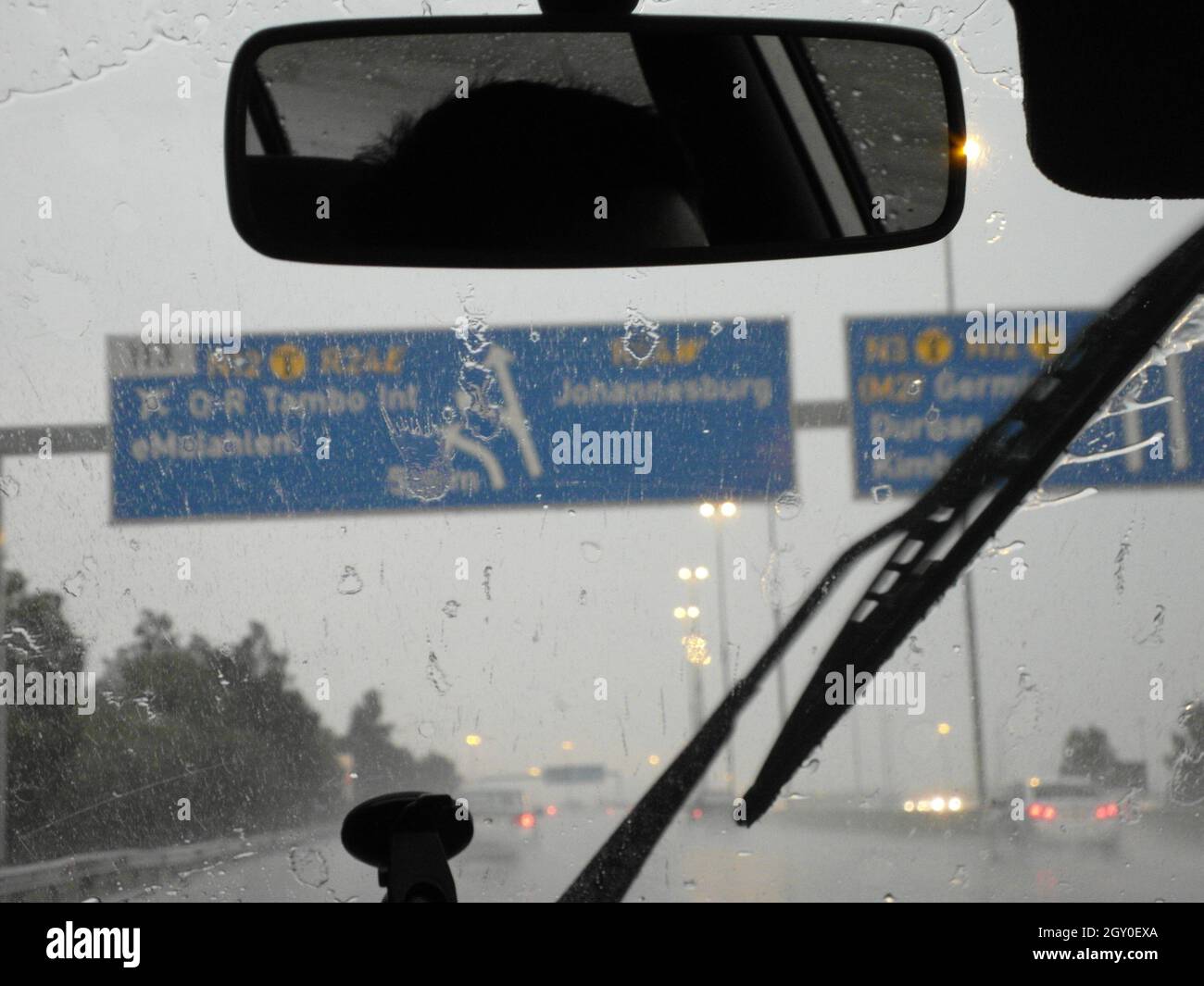 Rain on windshield reducing visibility whilst driving through a ...