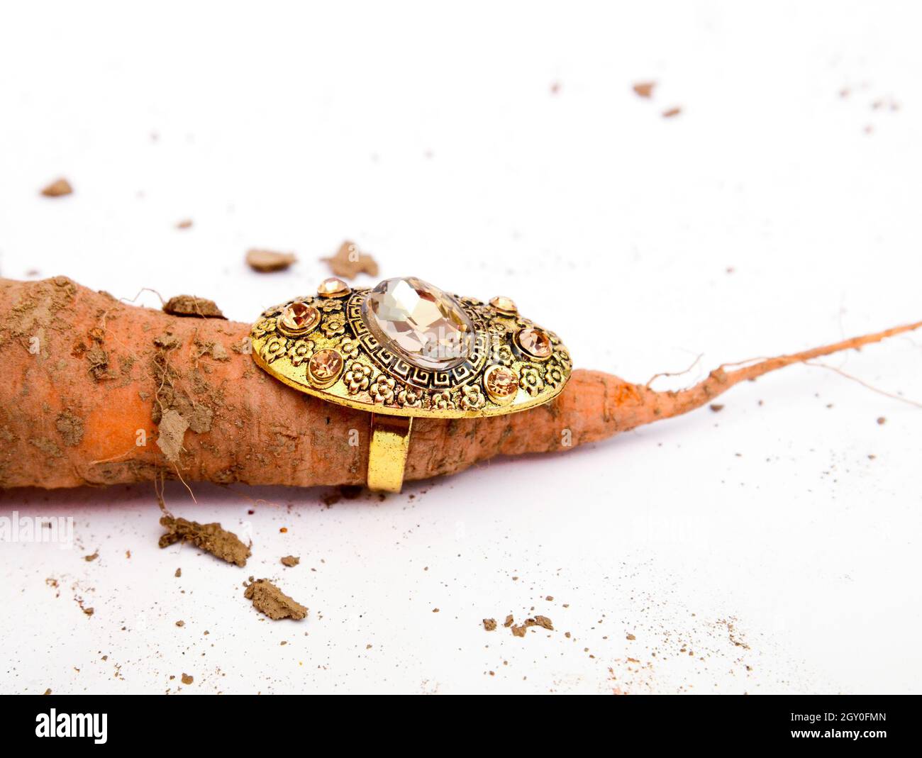 picture of a Fashion ring on a raw carrot Stock Photo - Alamy