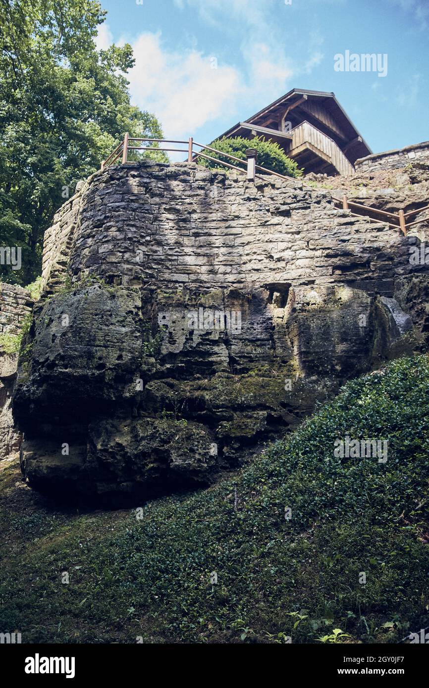 Vertical of park stone wall structure on stone cliffs Stock Photo - Alamy