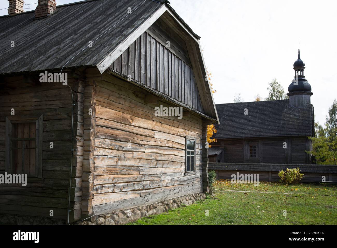 An old rustic wooden hut. In the background there is a rustic wooden ...