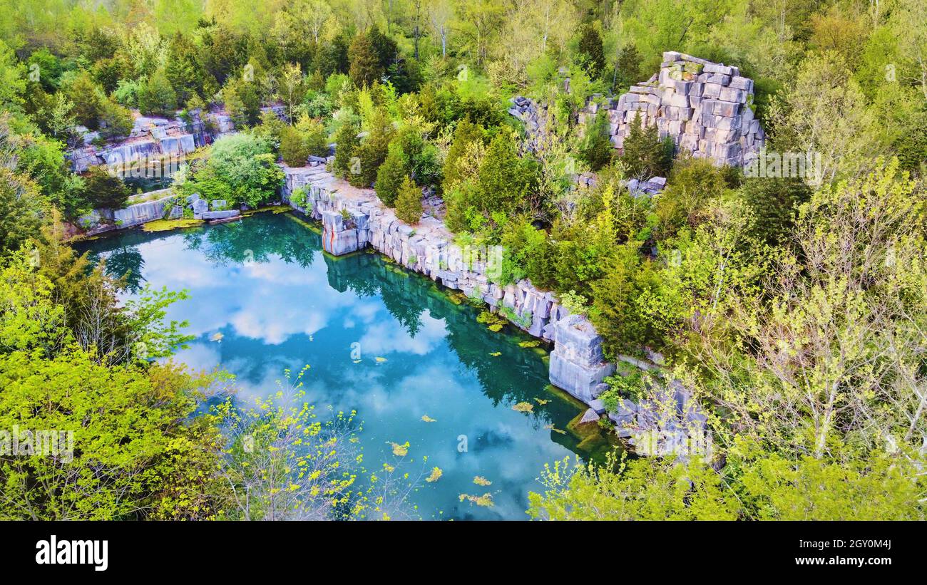 Aerial of large empty stone quarry with blue water Stock Photo - Alamy