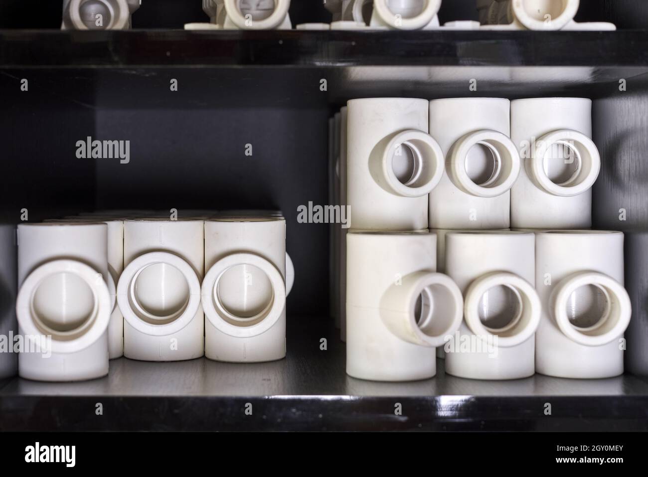 Set of polypropylene, plastic corners for connecting pipes on a white ...
