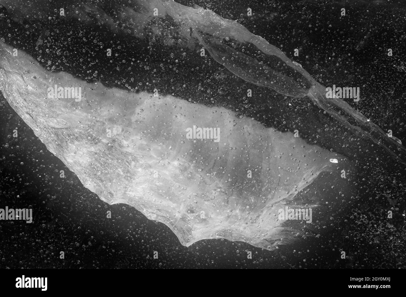 Frozen ice on lake Black and White Stock Photos & Images - Alamy