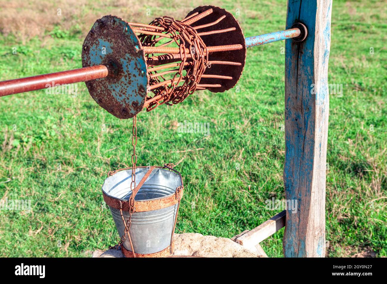 Well bucket and well mechanism . Source of pure drinking water Stock ...