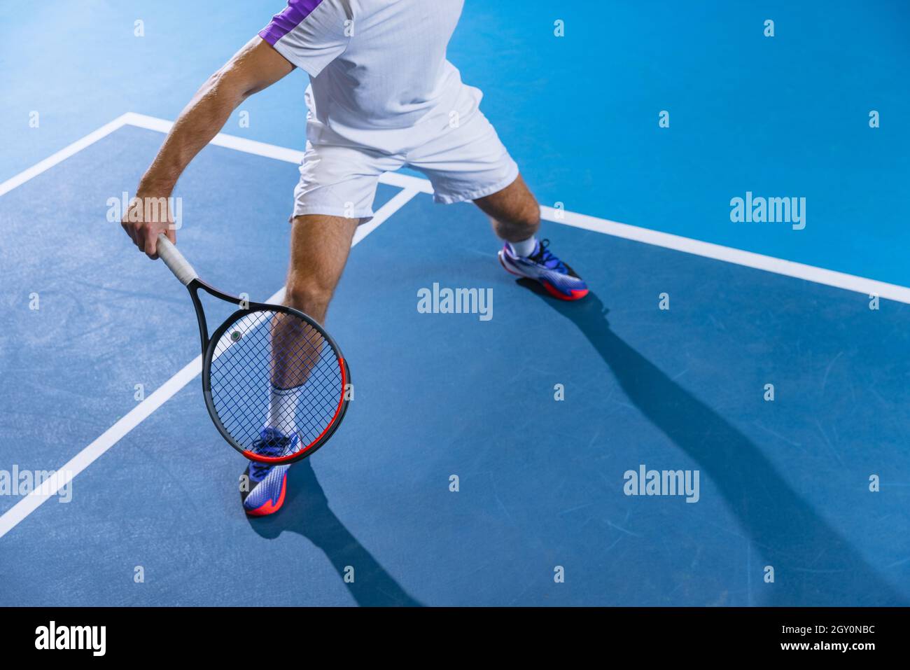 Cropped portrait of professional male tennis player in motion isolated ...