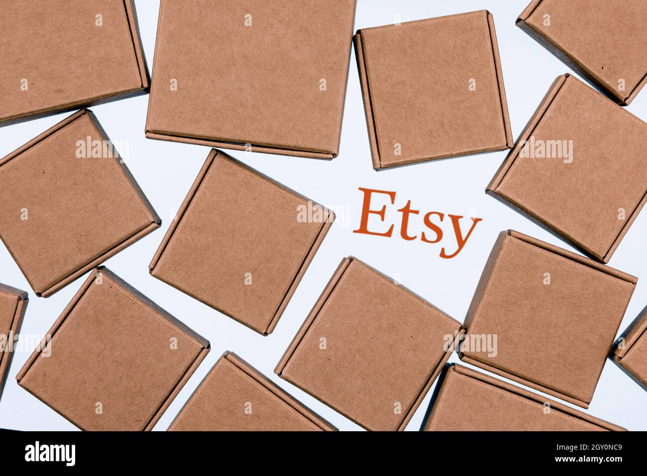 Etsy logo on a white background surrounded by parcel boxes Stock Photo ...