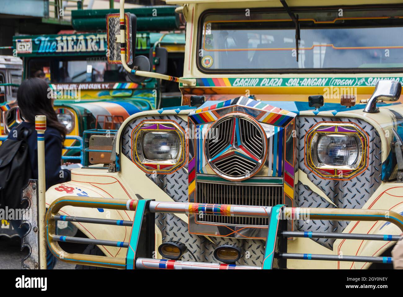 Front view of a colorful jeepney in the streets of Baguio city ...