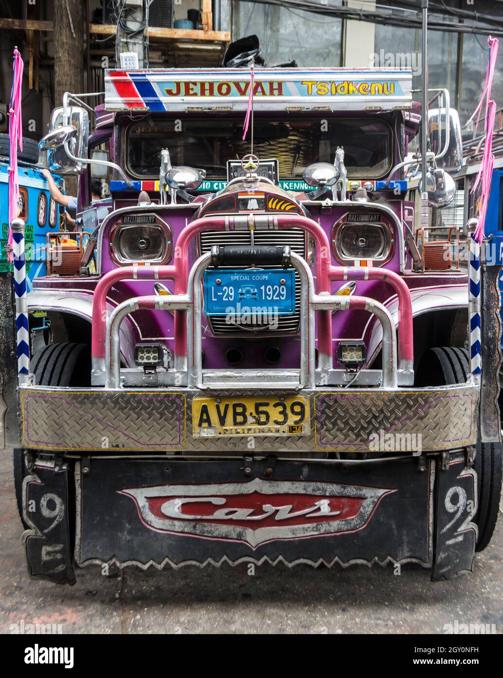 Front view of a colorful jeepney in the streets of Baguio city ...