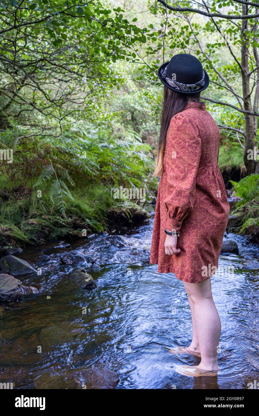 Girl standing alone in green hi-res stock photography and images - Alamy