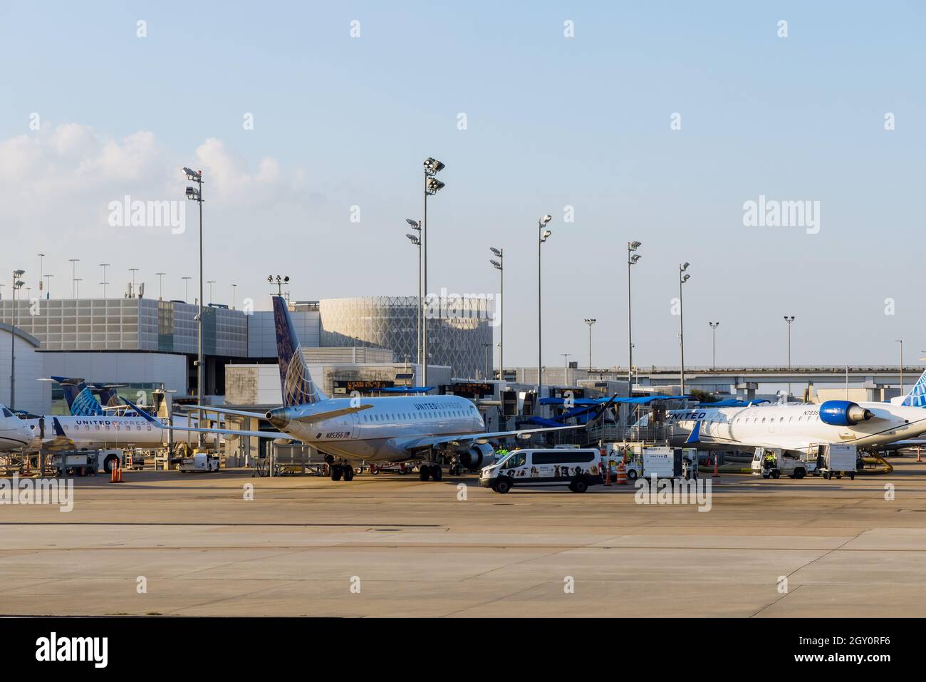 Parking at terminal gate passenger aircraft at the connected bridge is ...