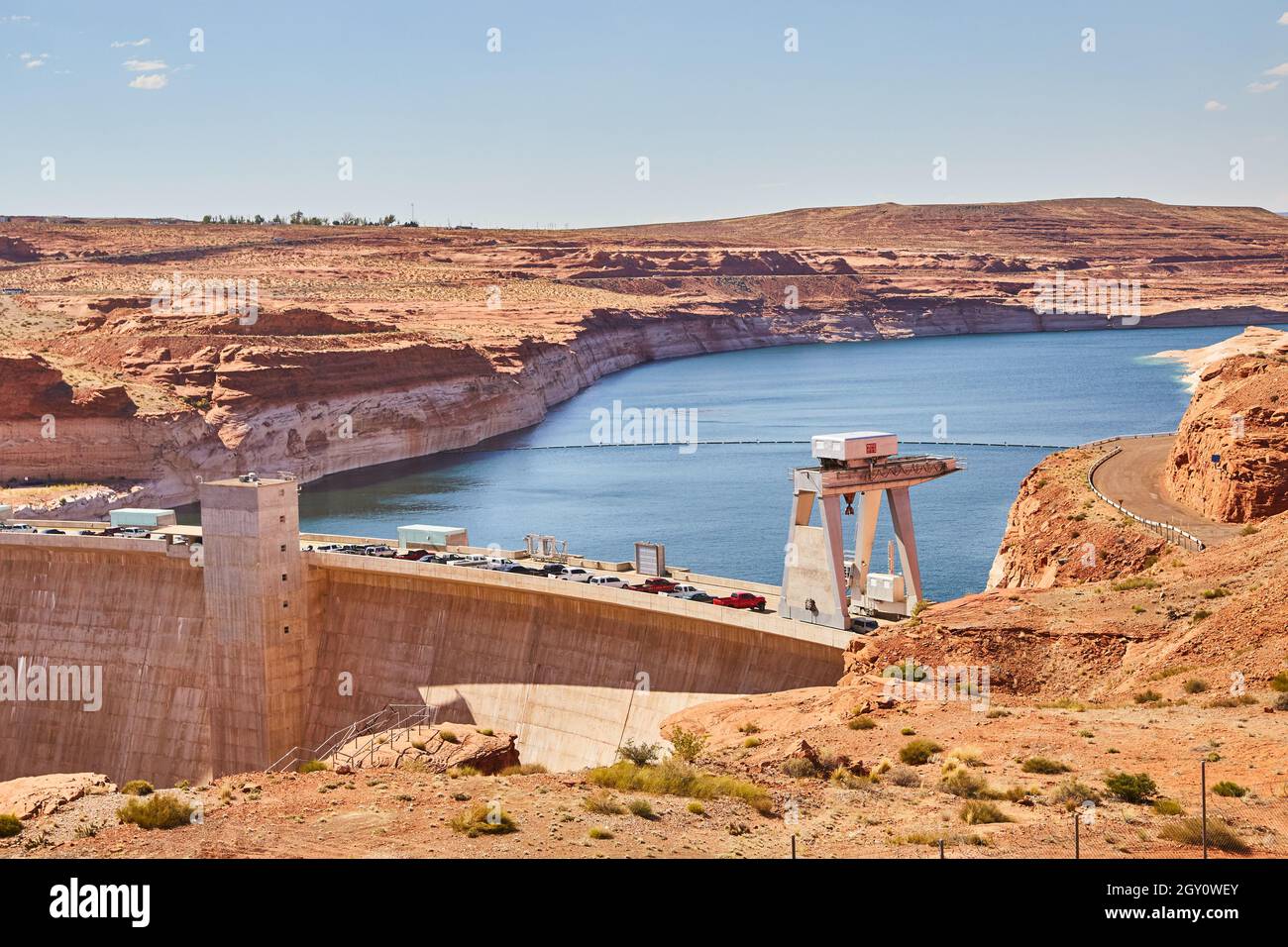 Dam blocking river water in red desert landscape Stock Photo - Alamy