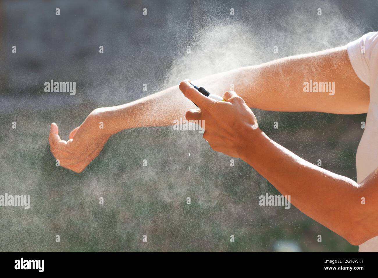 Woman spraying repellent hi-res stock photography and images - Alamy