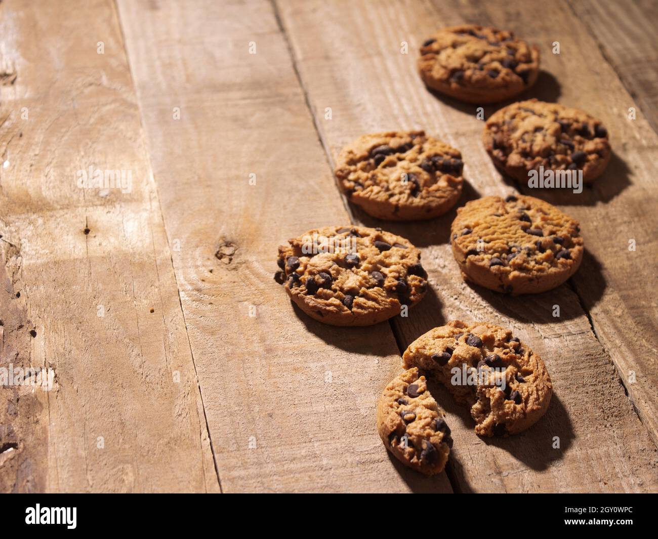 handmade chocolate chip cookies on a rustic dark wood background top ...