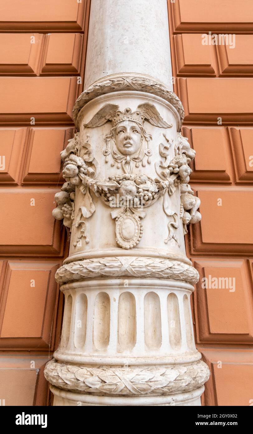 Pillar with a carved face Stock Photo - Alamy